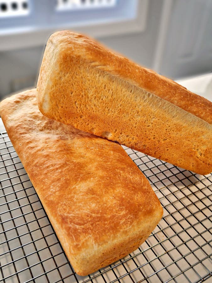 Two Loaves of Bread Cooling Off Stock Image - Image of closeup, bread ...