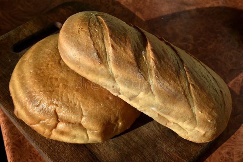 Two Loaves of Bread are on the Table. Stock Image - Image of ...
