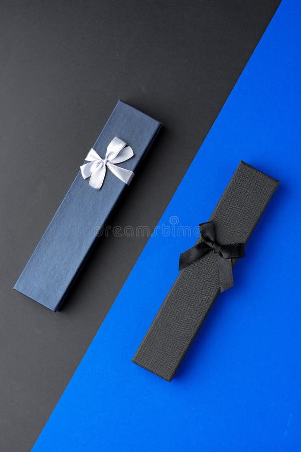 Two Long Jewelry Boxes on Black and Blue Background Stock Image - Image ...