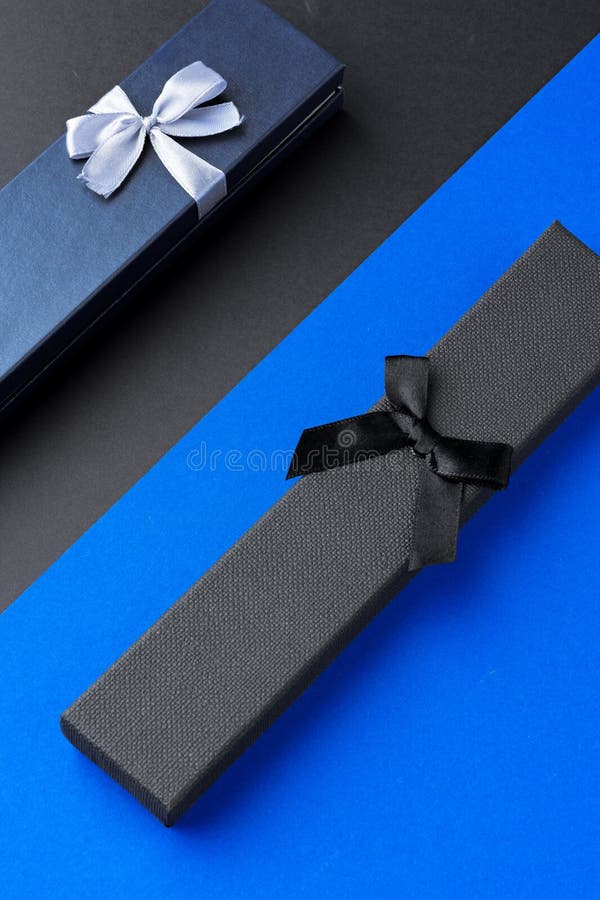 Two Long Jewelry Boxes on Black and Blue Background Stock Photo - Image ...
