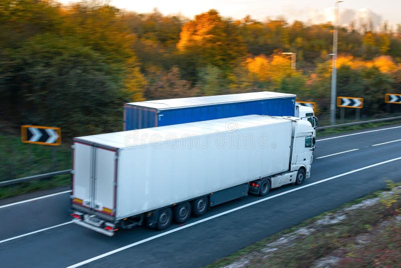 Two lorries on the road stock image. Image of overtaking - 164851863