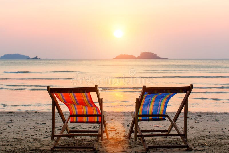 Two Lounge Chairs on Sunset Beach. Relax. Stock Image - Image of ocean ...