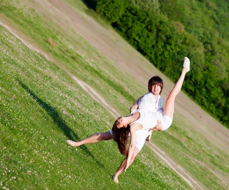 Two lovers on the grass stock photo. Image of nature - 62530502