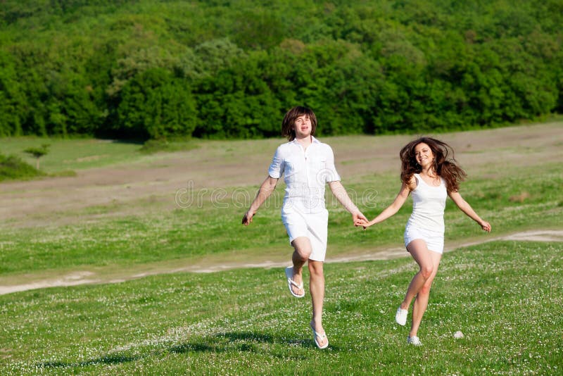 Two lovers on the grass stock image. Image of nature - 62530511