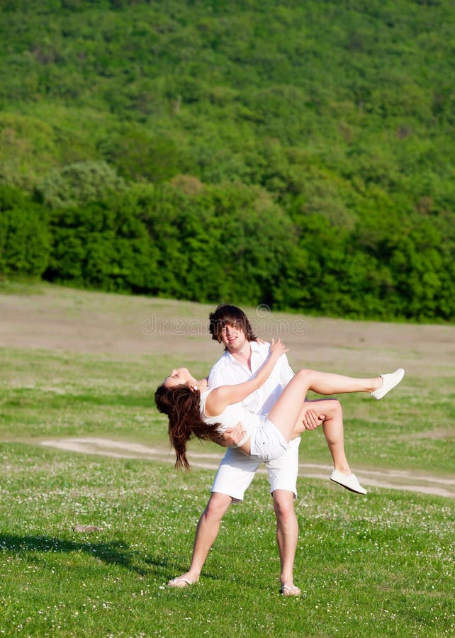 Two lovers on the grass stock photo. Image of adult, hands - 62530522