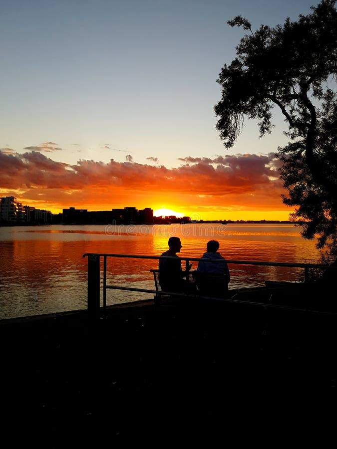 Two Lovers Looking at the City View during Sunset Stock Photo - Image ...