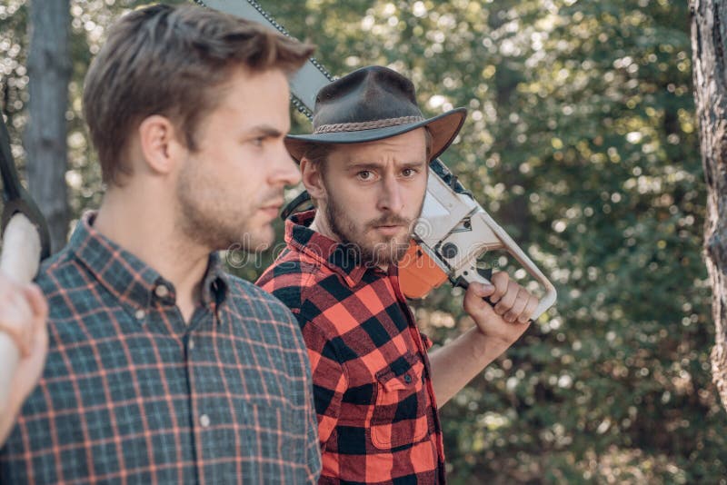 Two Lumberjacks Portrait with Chainsaw and Axe. Stock Image - Image of ...