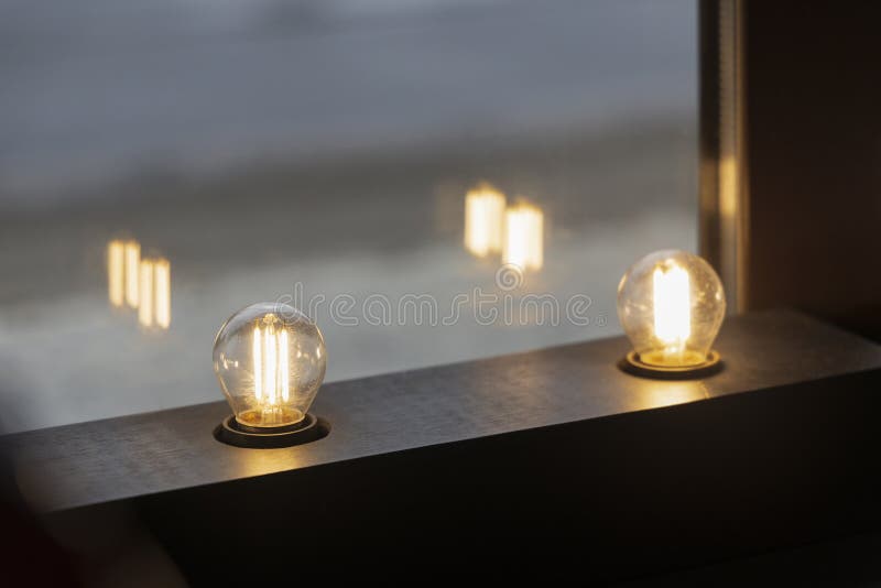 Two Luminous Electric Bulbs with Reflections Stock Image - Image of ...