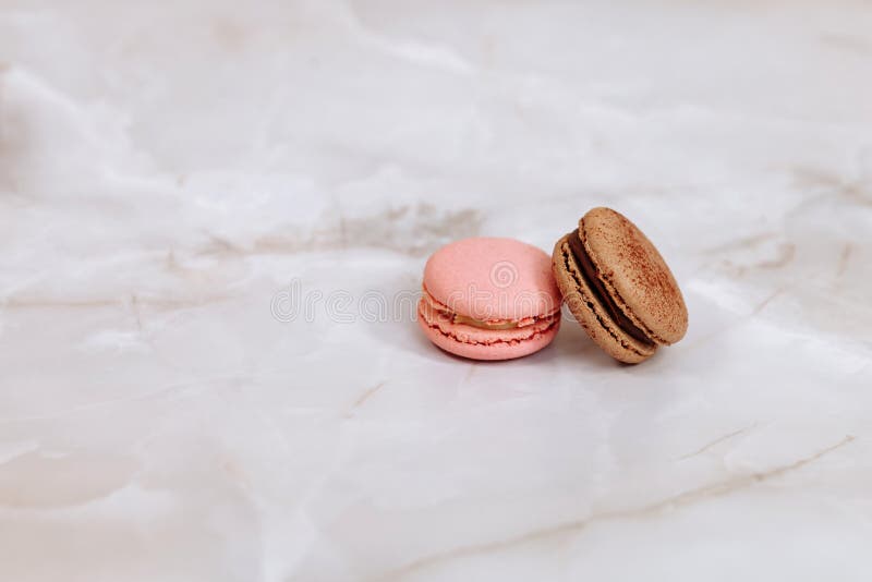 Two Macarons Lie on a White Surface Stock Image - Image of elegant ...