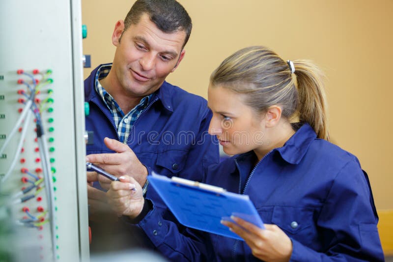 Two Machinists Working on Machine Stock Image - Image of machinist ...