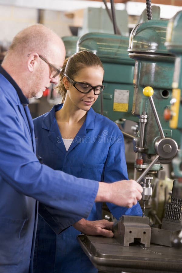 Two Machinists Working on Machine Stock Image - Image of drill, mature ...