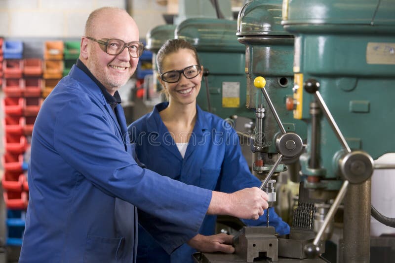 Two Machinists Working on Machine Stock Image - Image of drill, mature ...