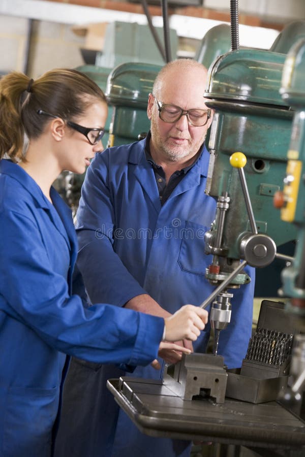 Two Machinists Working on Machine Stock Image - Image of coworker ...