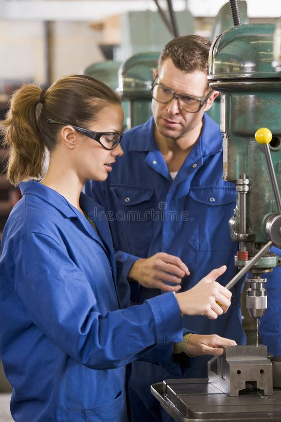 Two Machinists Working on Machine Stock Image - Image of blue, engineer ...