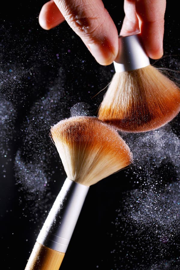 Two Makeup Brushes. Cloud of Powder on a Black Background Stock Photo ...