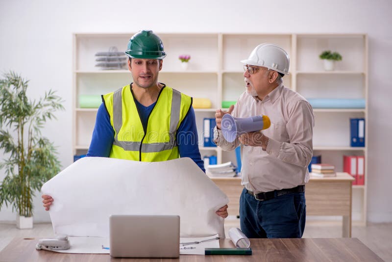 Two Male Architects Working on the Project Stock Photo - Image of ...