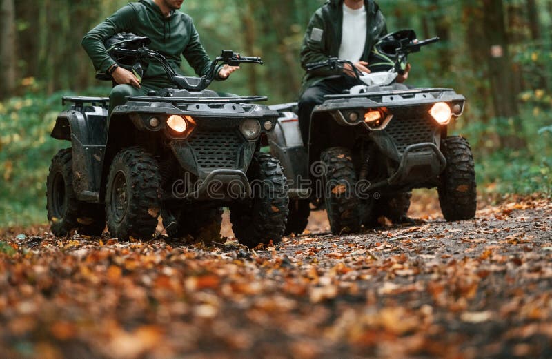 Two Male Atv Riders is in the Forest Together Stock Image - Image of ...