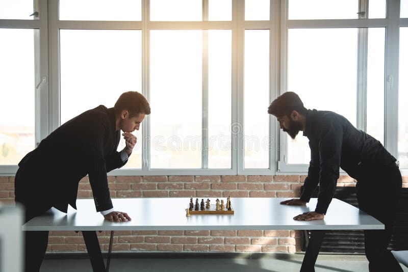 Two Male Businessmen, Rivals are Playing Chess. Strategy and Rivalry ...