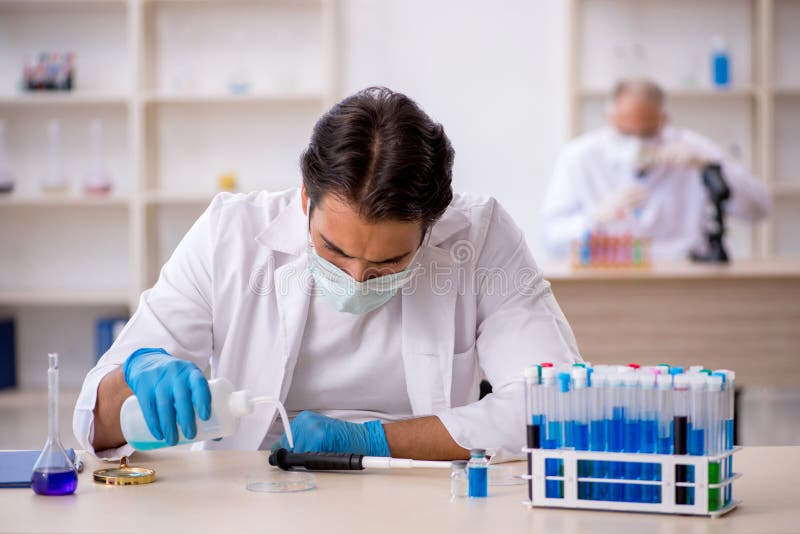 Two Male Chemist Working at the Lab Stock Image - Image of examining ...