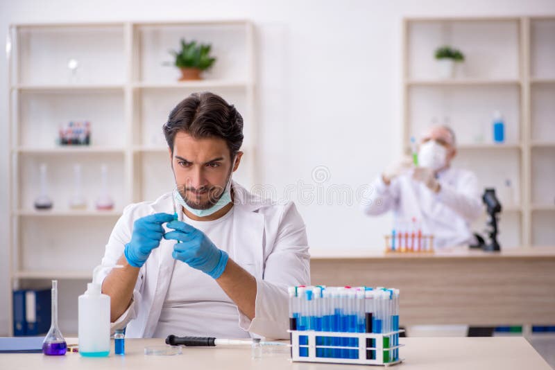 Two Male Chemist Working at the Lab Stock Image - Image of experiment ...