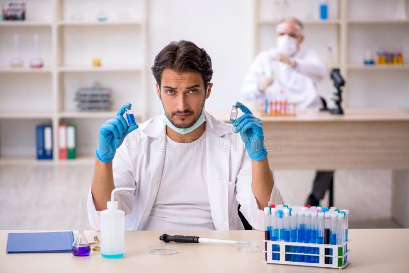 Two Male Chemist Working at the Lab Stock Image - Image of chemical ...