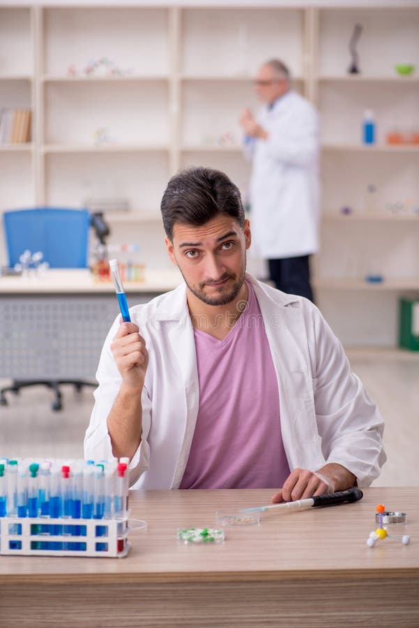 Two Male Chemists Working at the Lab Stock Photo - Image of analyzing ...