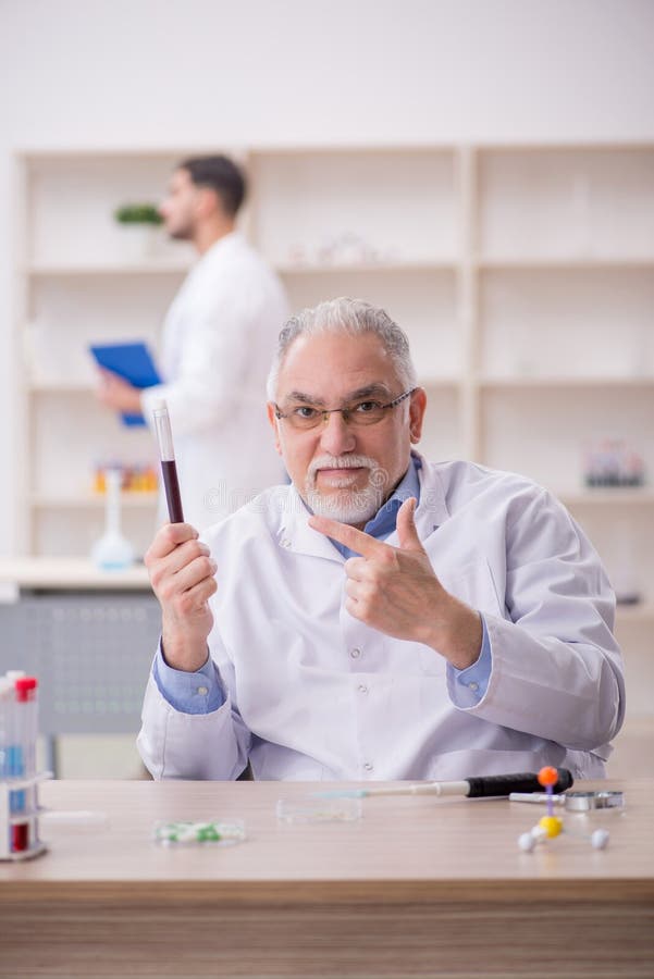 Two Male Chemists Working at the Lab Stock Image - Image of working ...