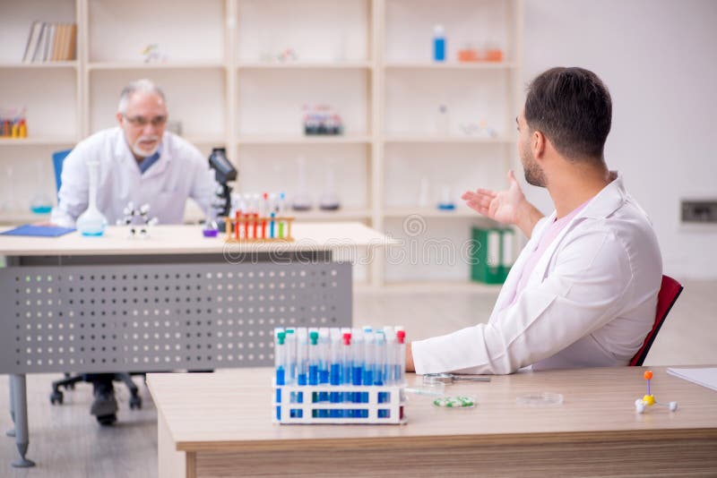 Two Male Chemists Working at the Lab Stock Photo - Image of team ...