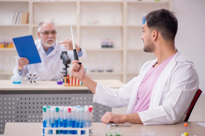 Two Male Chemists Working at the Lab Stock Image - Image of scientific ...
