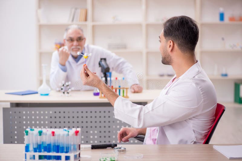 Two Male Chemists Working at the Lab Stock Photo - Image of chemist ...