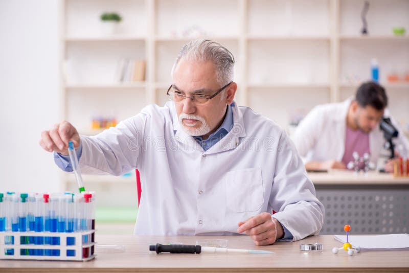 Two Male Chemists Working at the Lab Stock Photo - Image of solution ...
