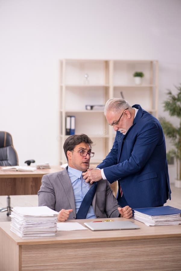 Two Male Colleagues Sitting in the Office Stock Photo - Image of verbal ...