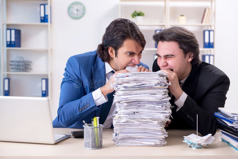 Two Male Colleagues Unhappy with Excessive Work Stock Image - Image of ...