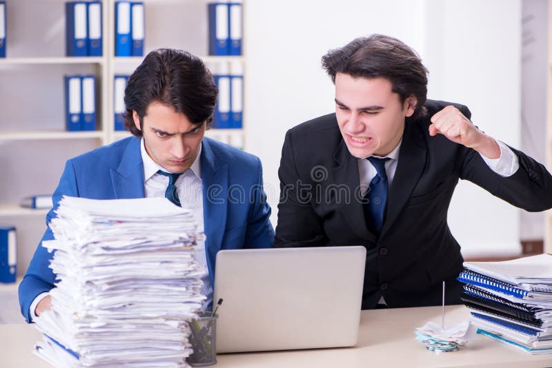 Two Male Colleagues Unhappy with Excessive Work Stock Photo - Image of ...