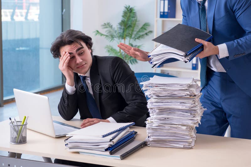 Two Male Colleagues Unhappy with Excessive Work Stock Image - Image of ...