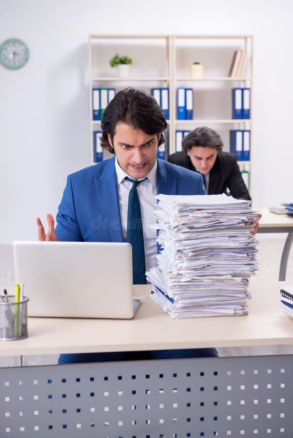Two Male Colleagues Unhappy with Excessive Work Stock Photo - Image of ...