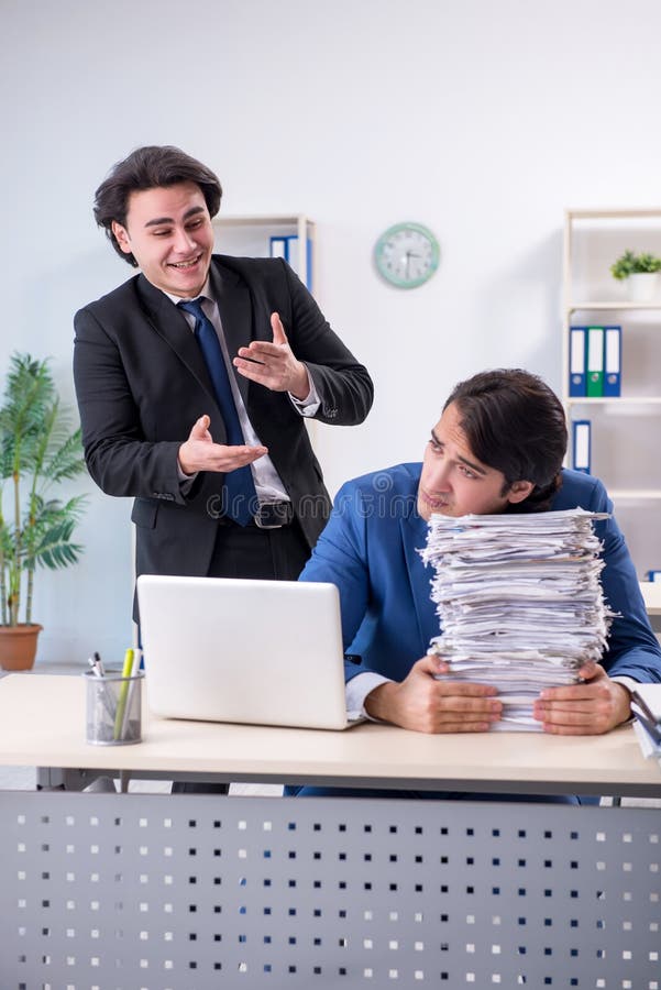 Two Male Colleagues Unhappy with Excessive Work Stock Image - Image of ...