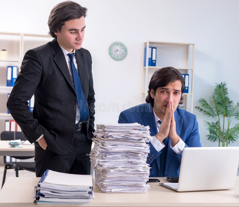 Two Male Colleagues Unhappy with Excessive Work Stock Image - Image of ...