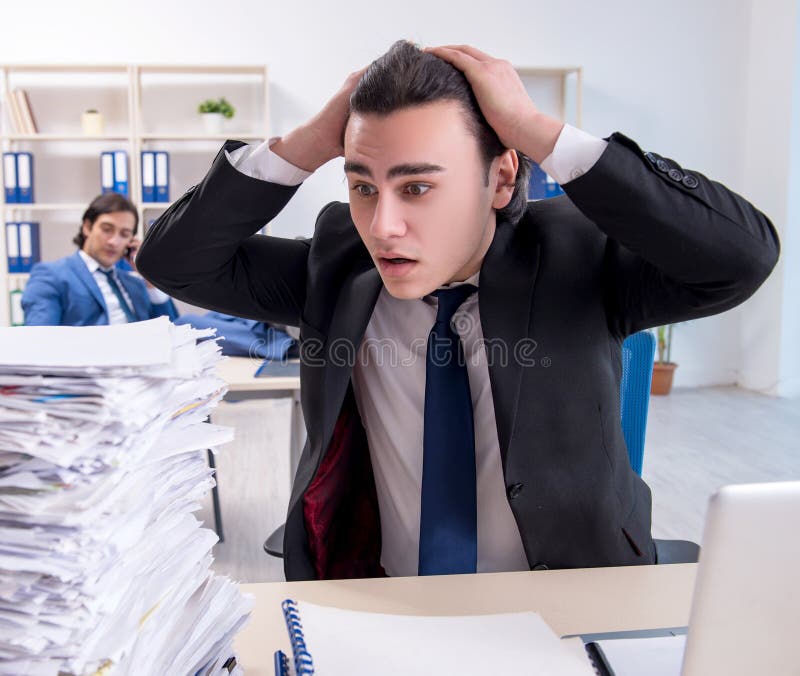 Two Male Colleagues Unhappy with Excessive Work Stock Image - Image of ...