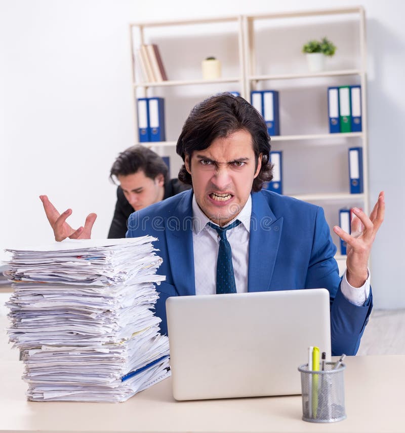 Two Male Colleagues Unhappy with Excessive Work Stock Photo - Image of ...