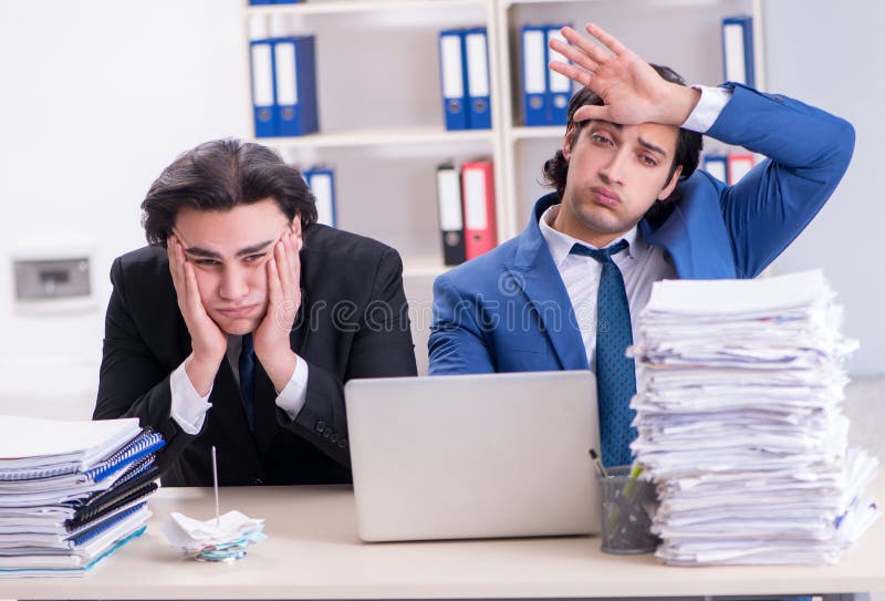 Two Male Colleagues Unhappy with Excessive Work Stock Photo - Image of ...