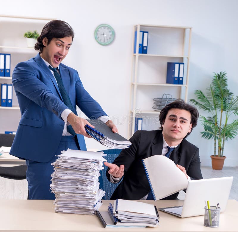 Two Male Colleagues Unhappy with Excessive Work Stock Image - Image of ...