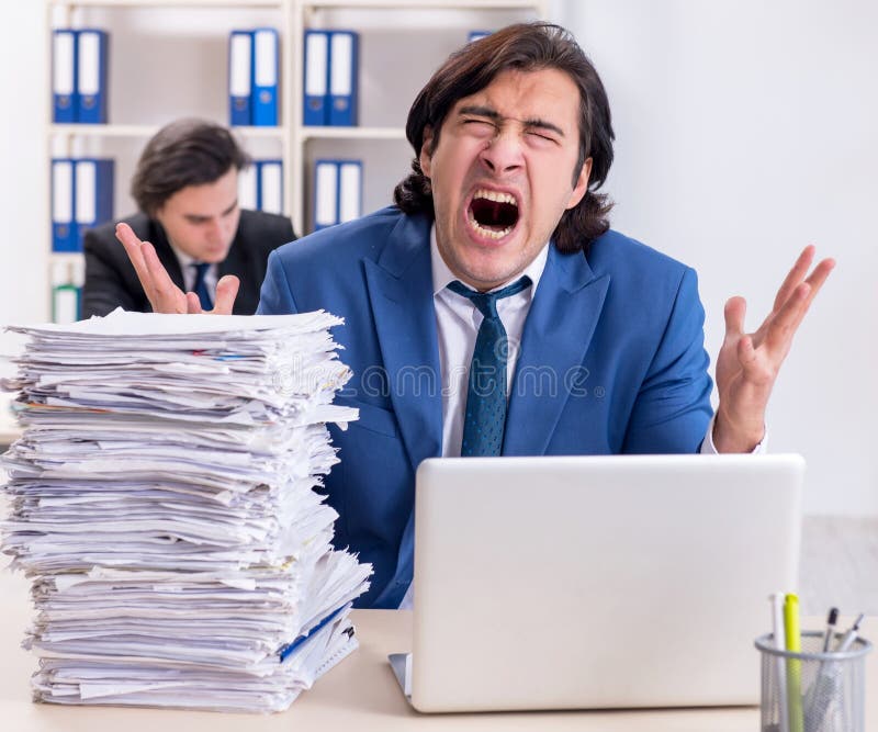 Two Male Colleagues Unhappy with Excessive Work Stock Photo - Image of ...