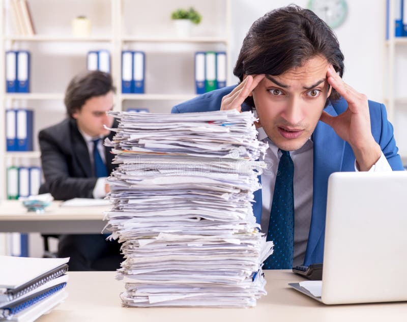 Two Male Colleagues Unhappy with Excessive Work Stock Photo - Image of ...