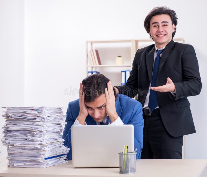 Two Male Colleagues Unhappy with Excessive Work Stock Photo - Image of ...