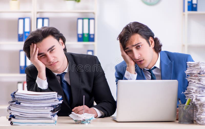 Two Male Colleagues Unhappy with Excessive Work Stock Photo - Image of ...