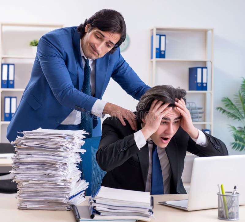 Two Male Colleagues Unhappy with Excessive Work Stock Image - Image of ...