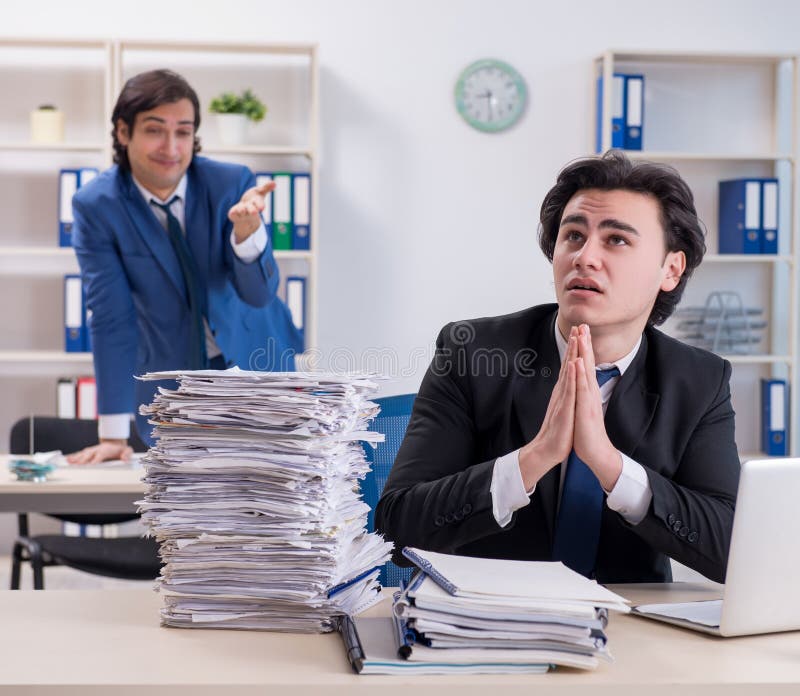 Two Male Colleagues Unhappy with Excessive Work Stock Photo - Image of ...