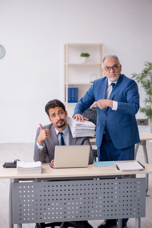Two Male Colleagues Working in the Office Stock Photo - Image of thumb ...