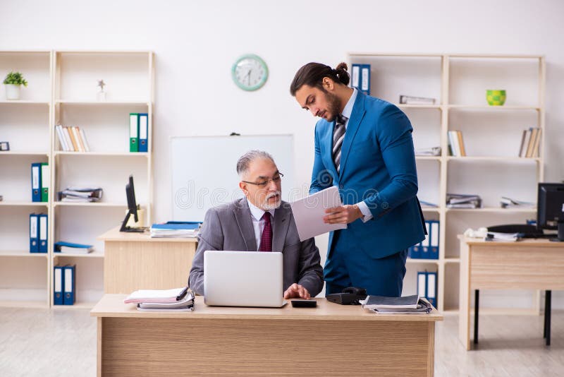 Two Male Colleagues Working in the Office Stock Photo - Image of ...